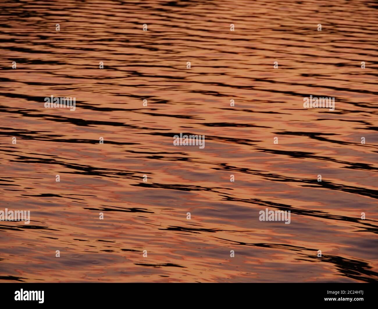 Golden water, the sun colors the sea in golden color Stock Photo - Alamy