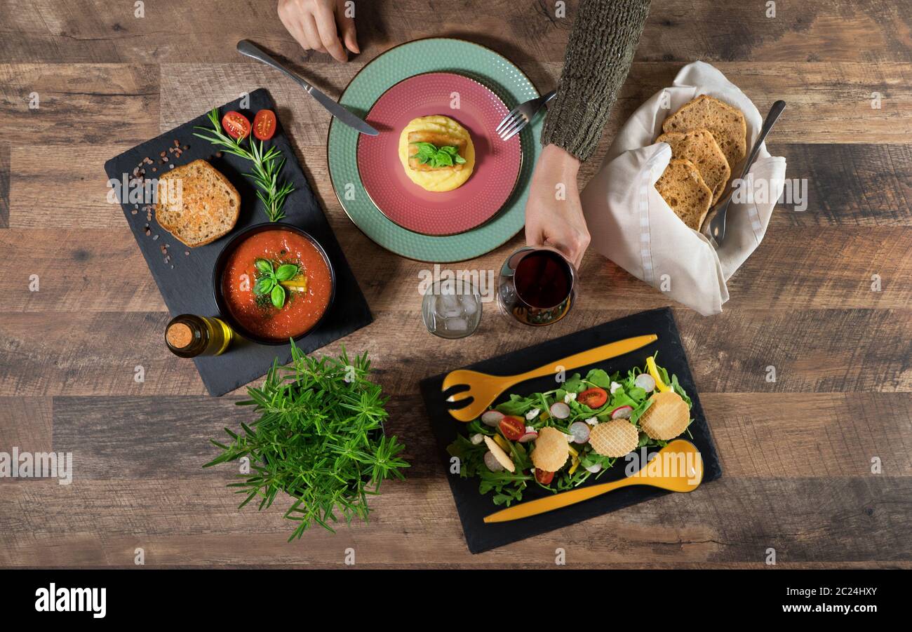 Woman having beautiful dinner in restaurant. Top view Stock Photo - Alamy