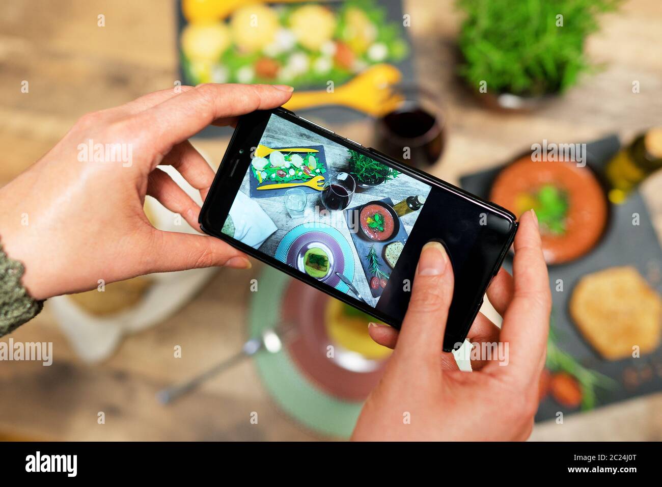 Woman photograph food phone hand hi-res stock photography and images ...