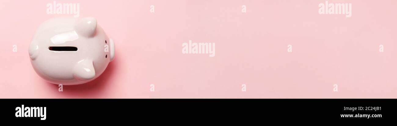 Simply minimal design pink piggy bank isolated on pink pastel ...