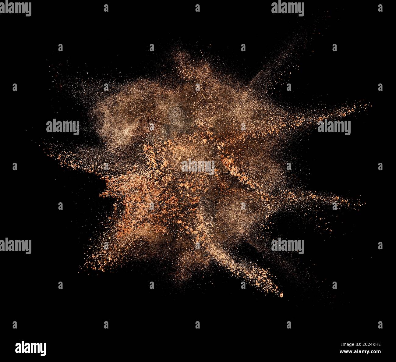 Explosion of brown powder on black background Stock Photo - Alamy