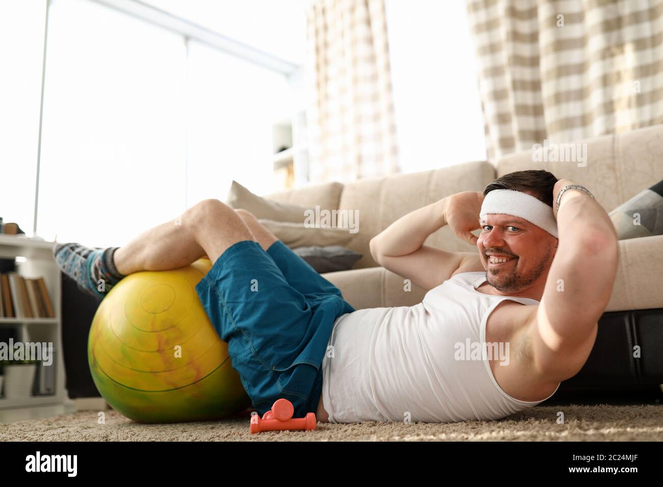 Guy stretching ball hi-res stock photography and images - Alamy