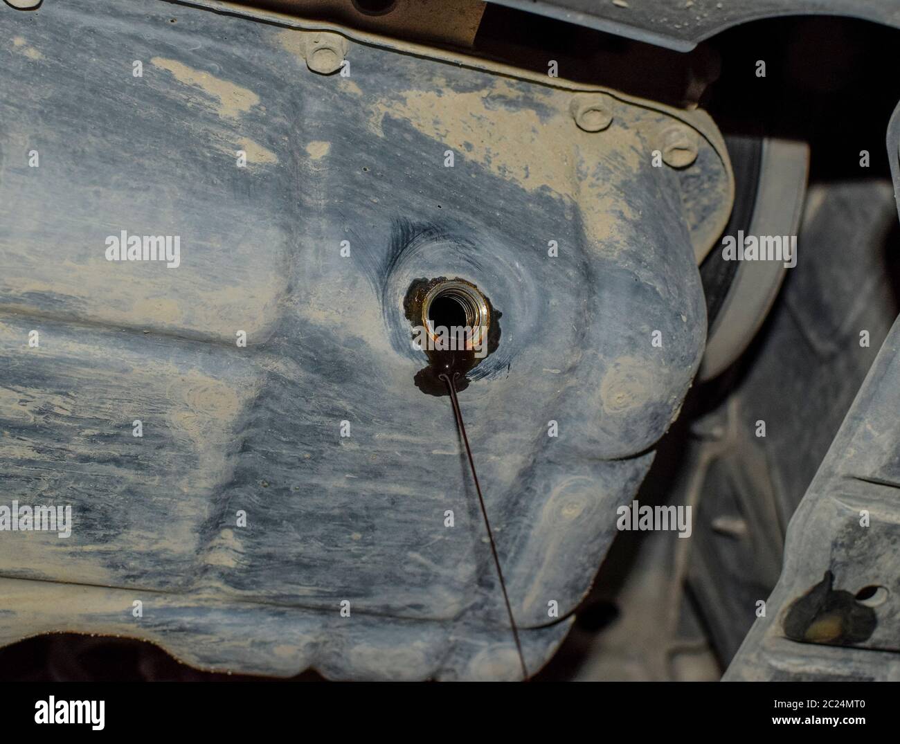 Drain the old oil from the engine through the drain plug. Changing the ...