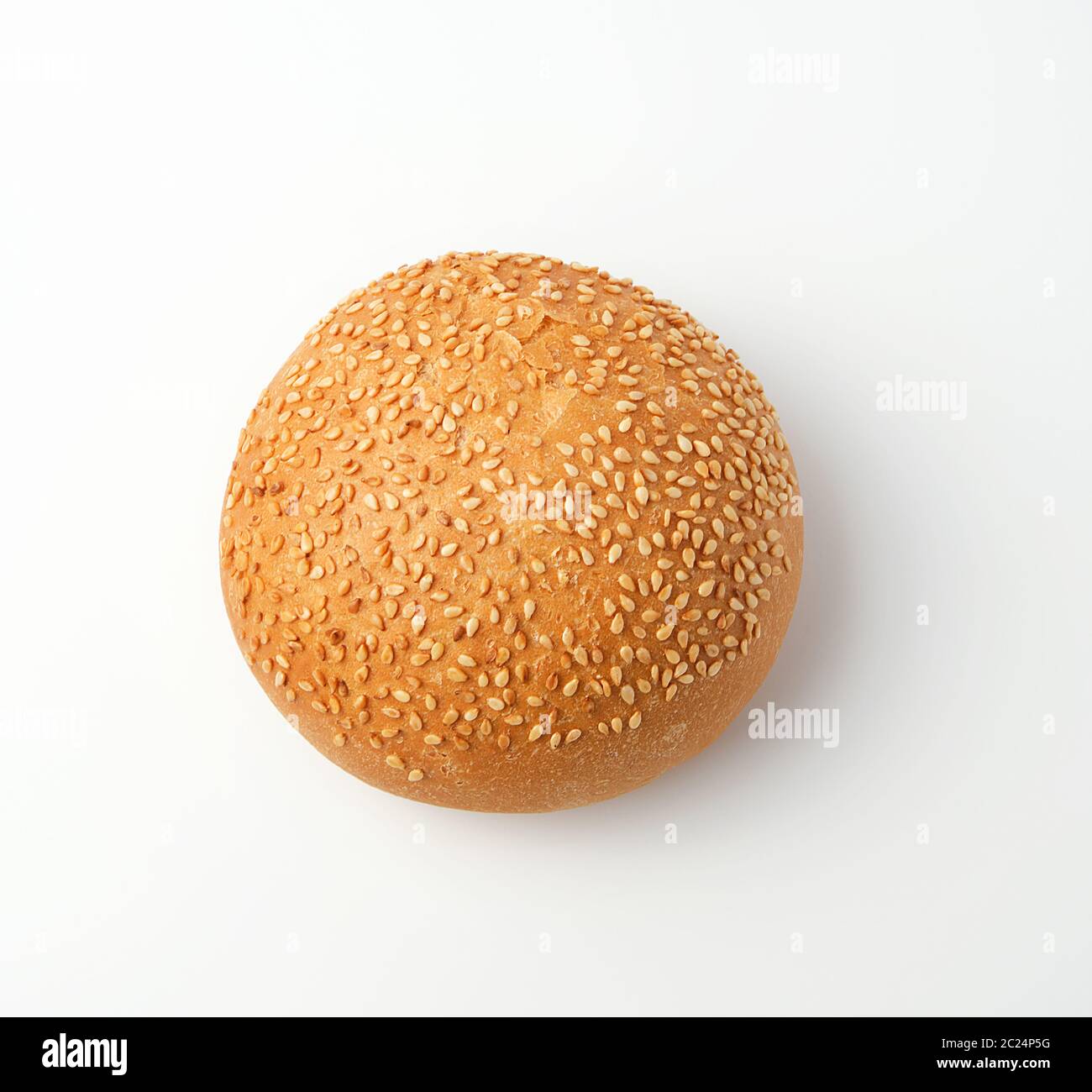 baked whole round bun with sesame seeds made from white wheat flour on ...