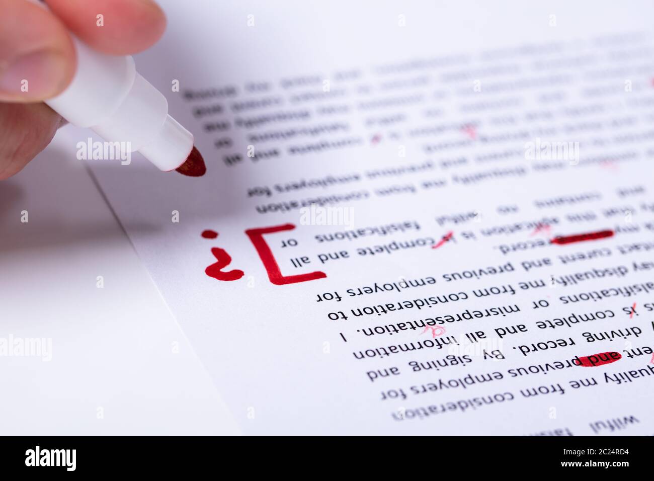 Human Hand Holding Red Marker During Spellchecking Text With Question ...