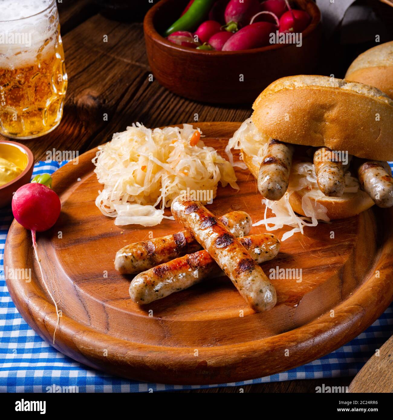 rustic Thuringian bratwurst with sauerkraut and roll Stock Photo - Alamy