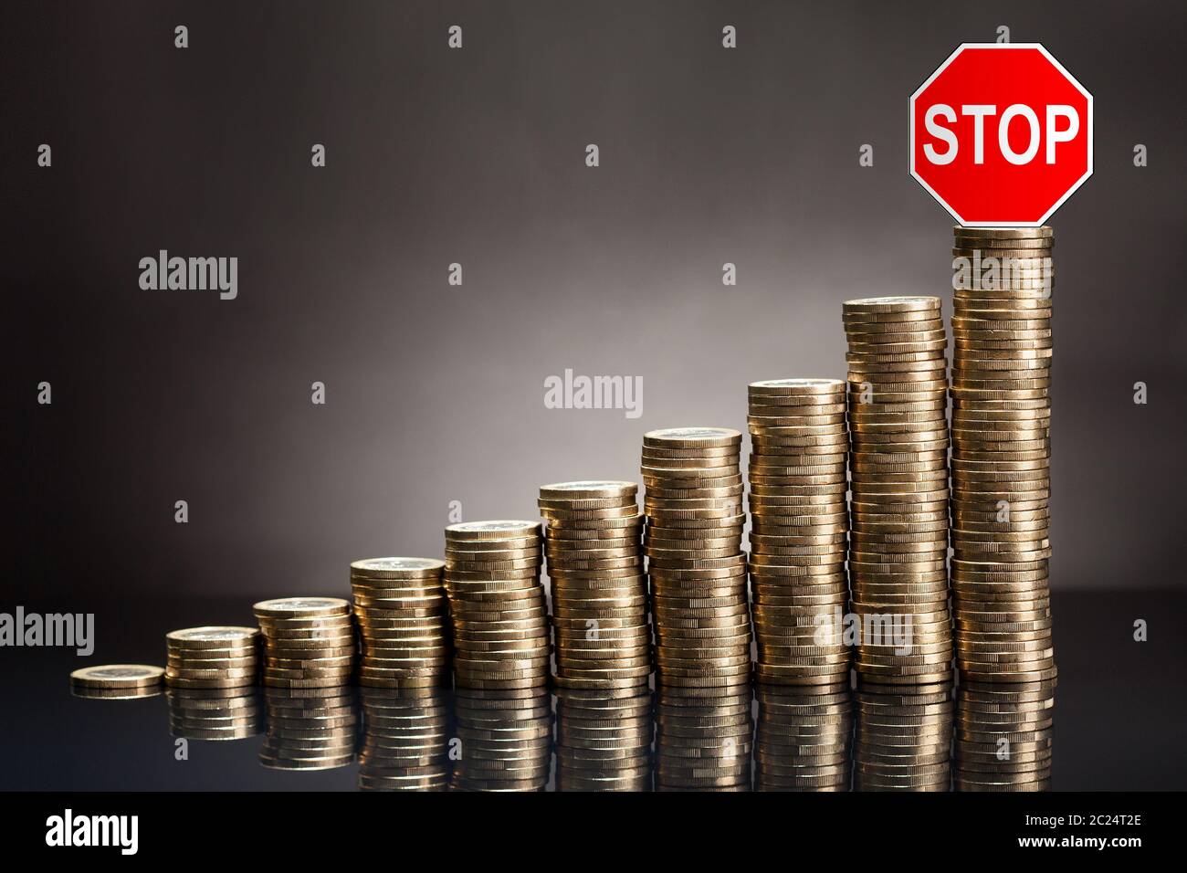 Rising Stack Of Coins With Red Stop Caution Against Checkered ...