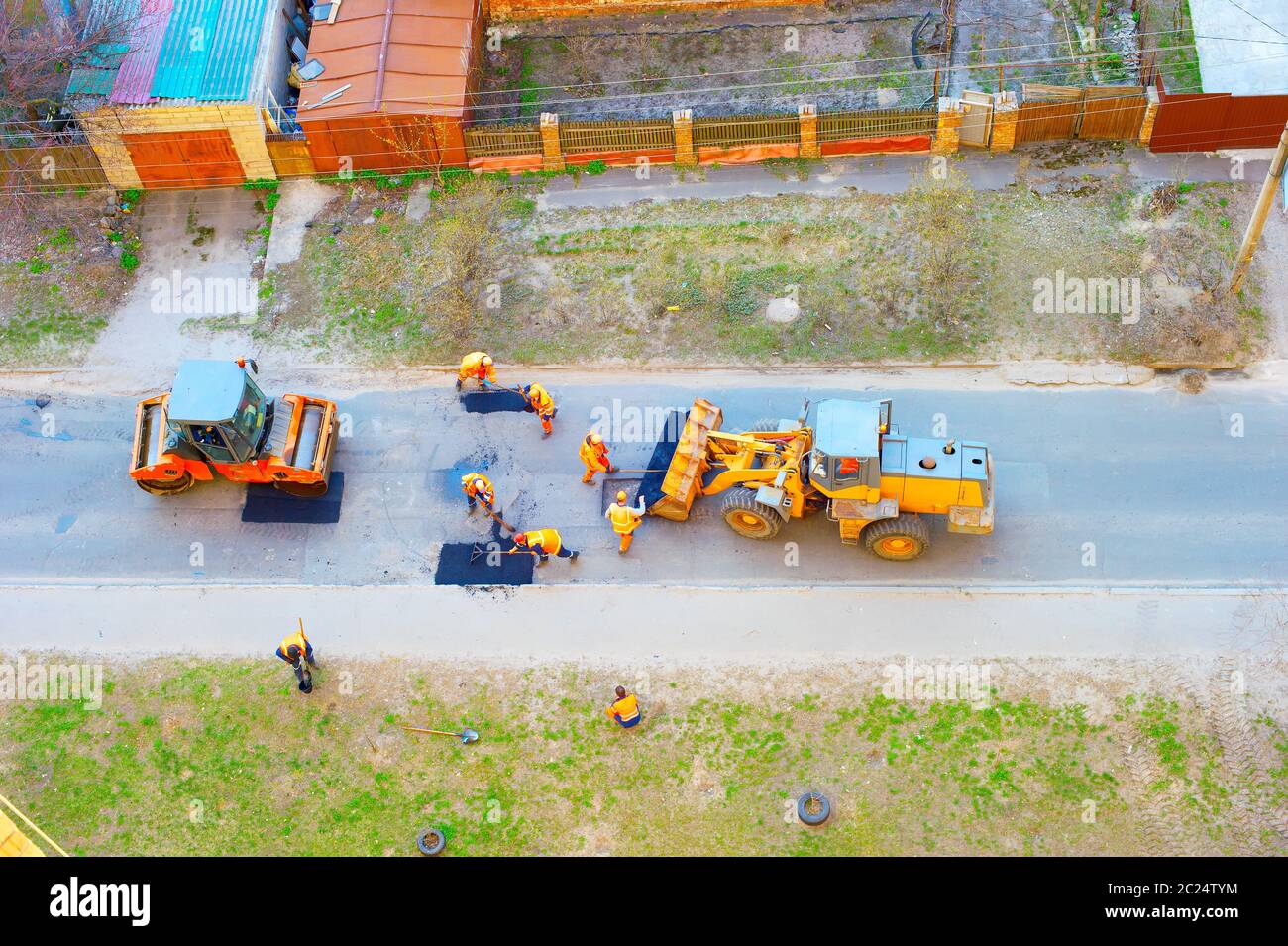 fixing road, roller compactor, excavator Stock Photo - Alamy