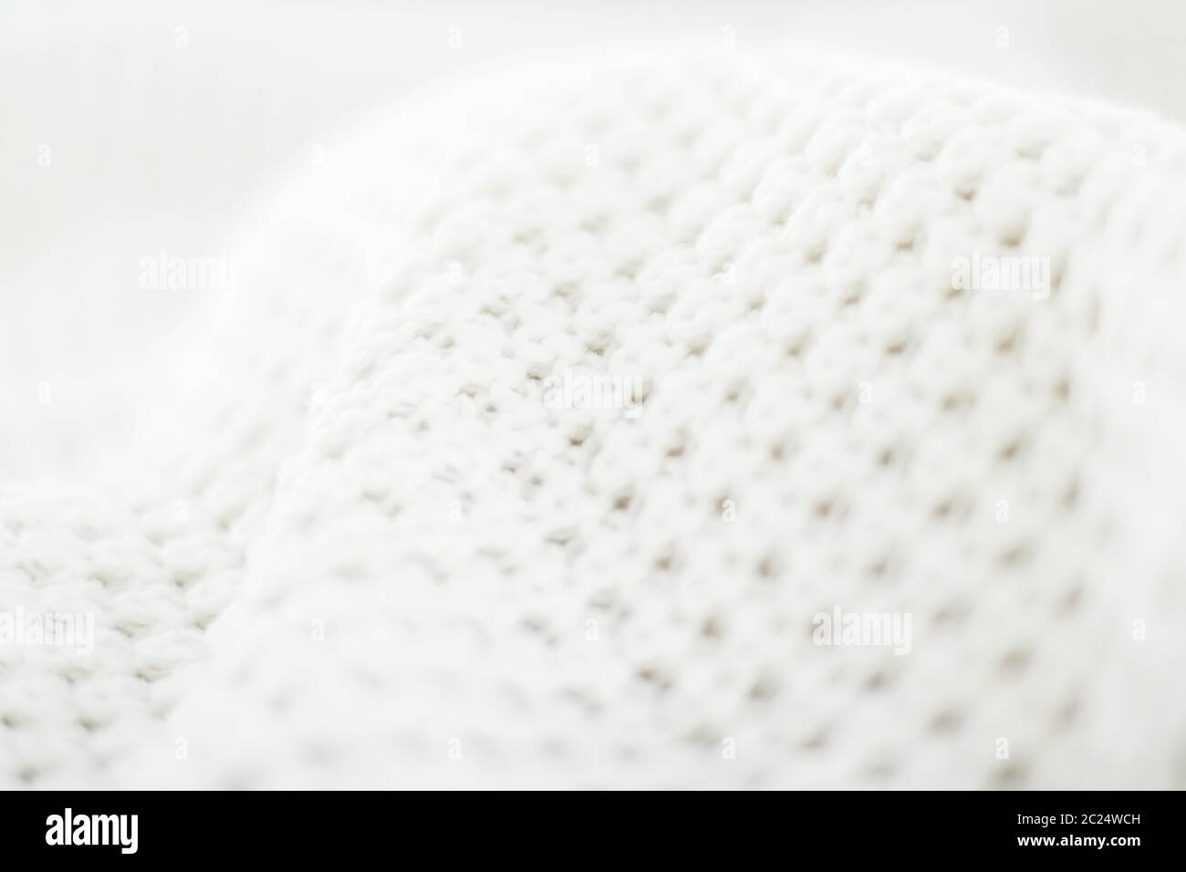 Warm knitted clothes, soft and white Stock Photo - Alamy
