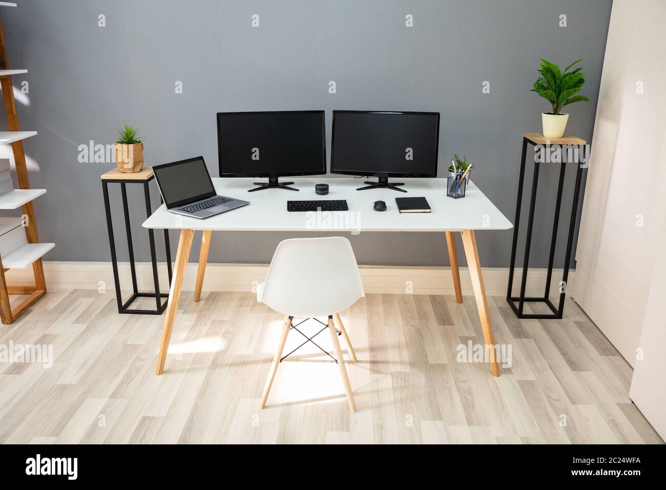 Computer On Desk In Modern Office Interior Stock Photo - Alamy