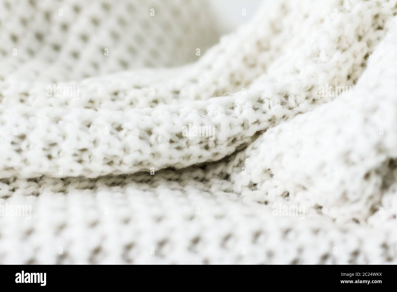 Warm knitted clothes, soft and white Stock Photo - Alamy