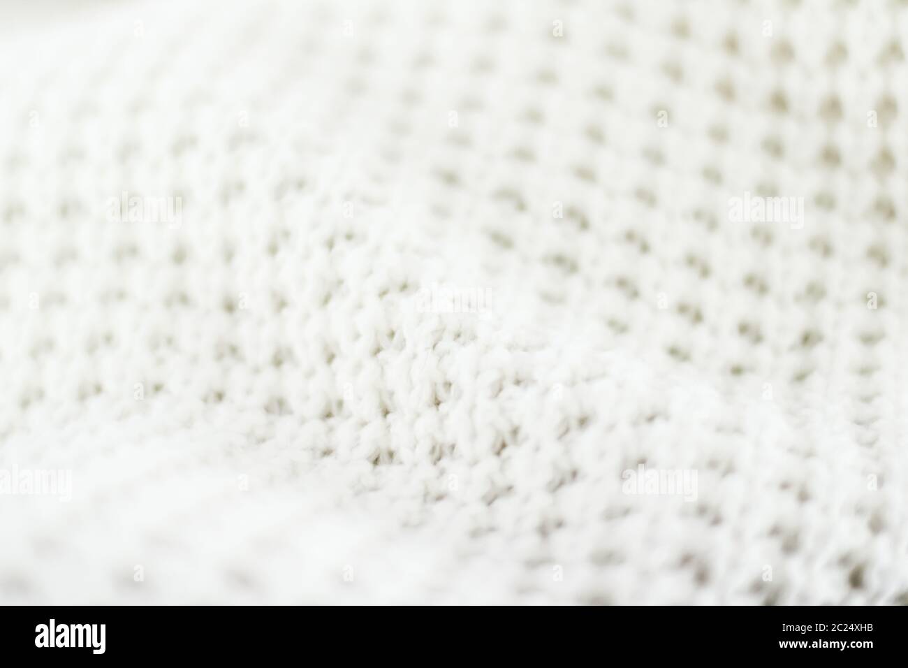 Warm knitted clothes, soft and white Stock Photo - Alamy