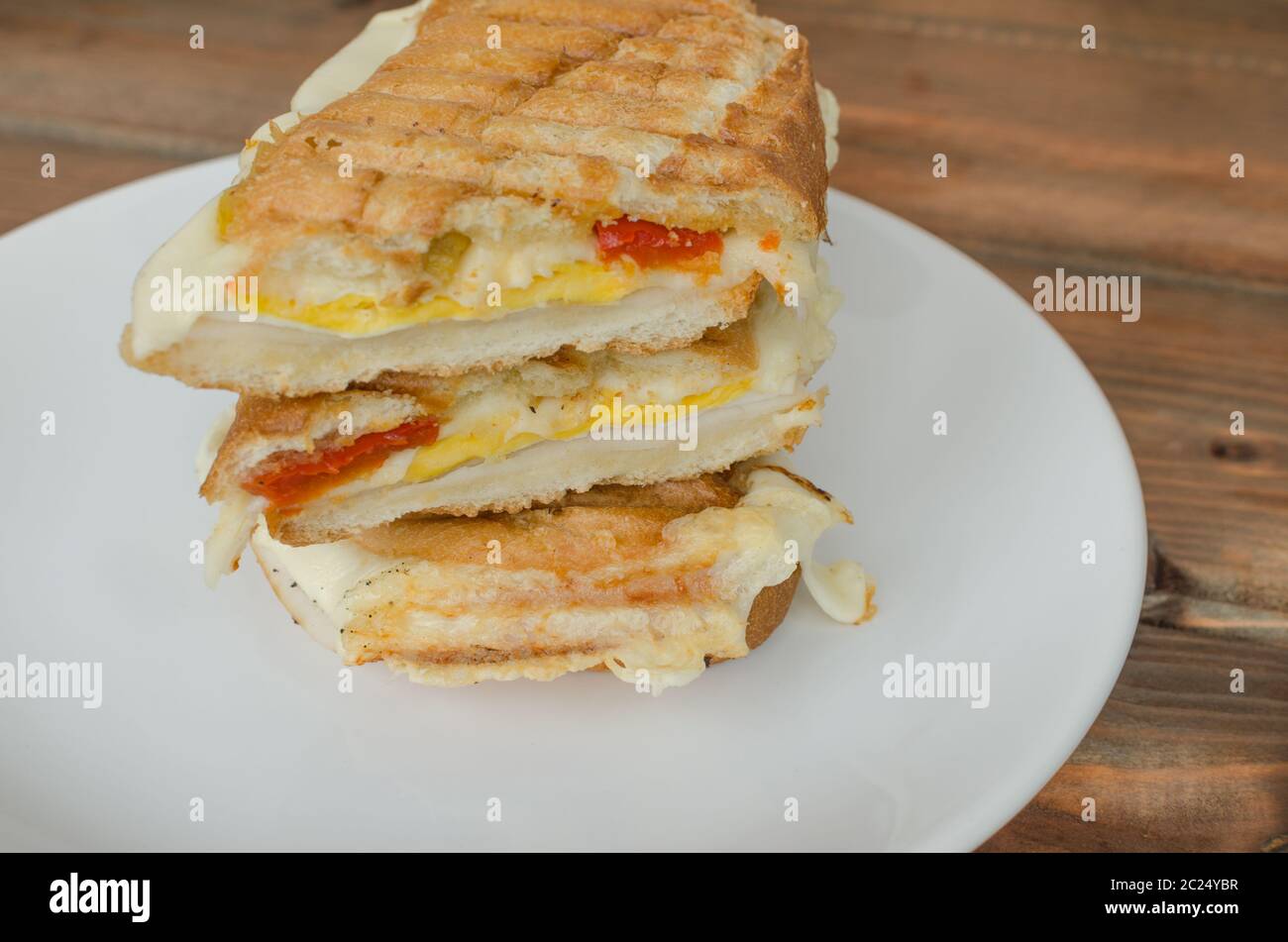 Panini sandwiches italien with paprica, cheese, eggs and ham Stock ...