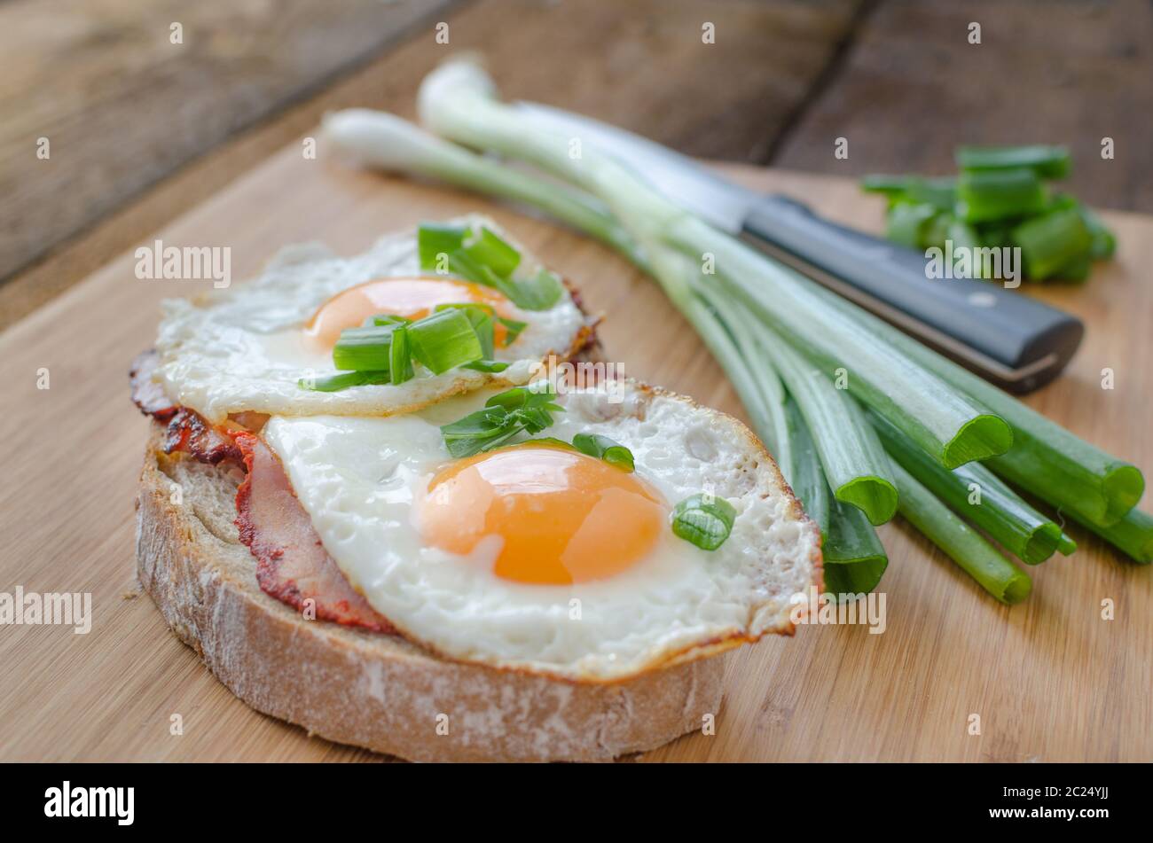 Fresh bread with eggs and ham and spring onion Stock Photo - Alamy