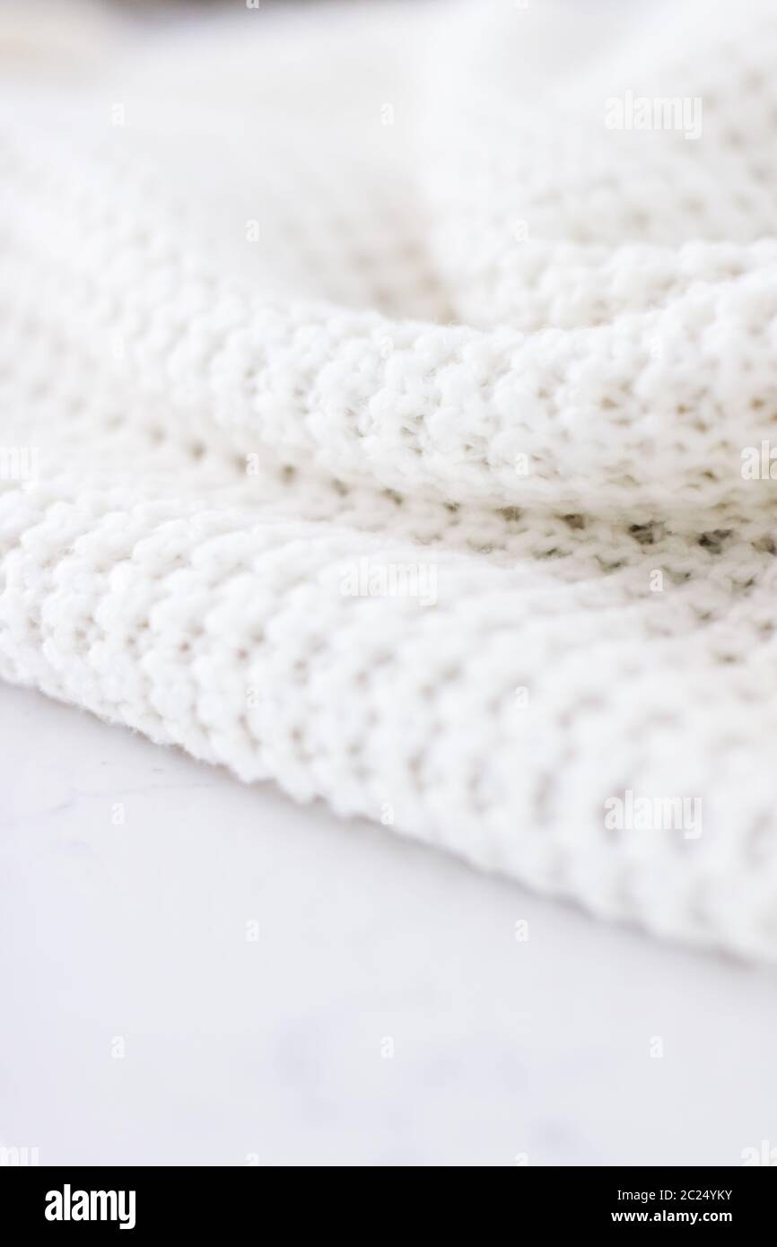 Warm knitted clothes, soft and white Stock Photo - Alamy