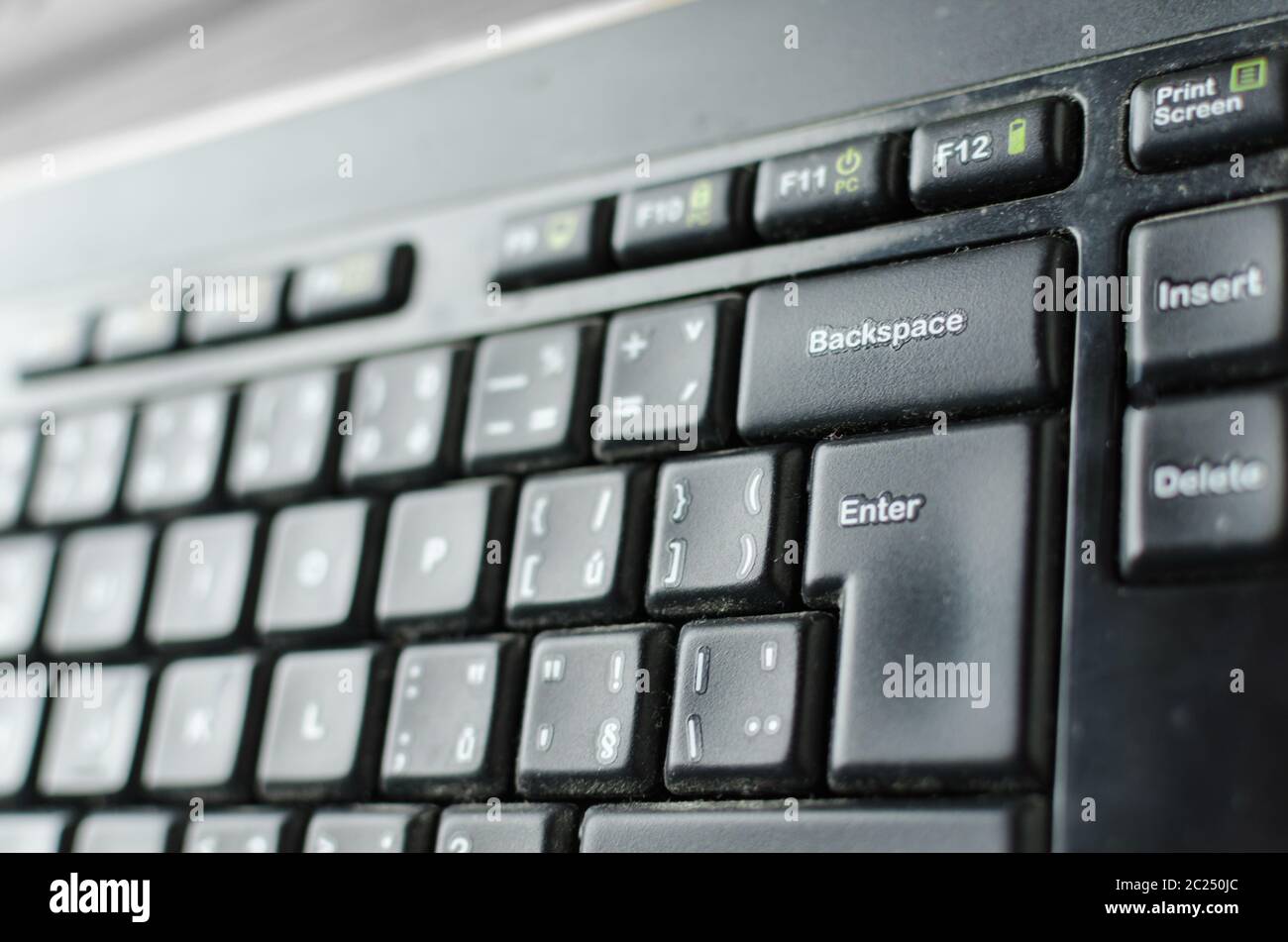 Keyboard with enter button, with light from left side Stock Photo - Alamy