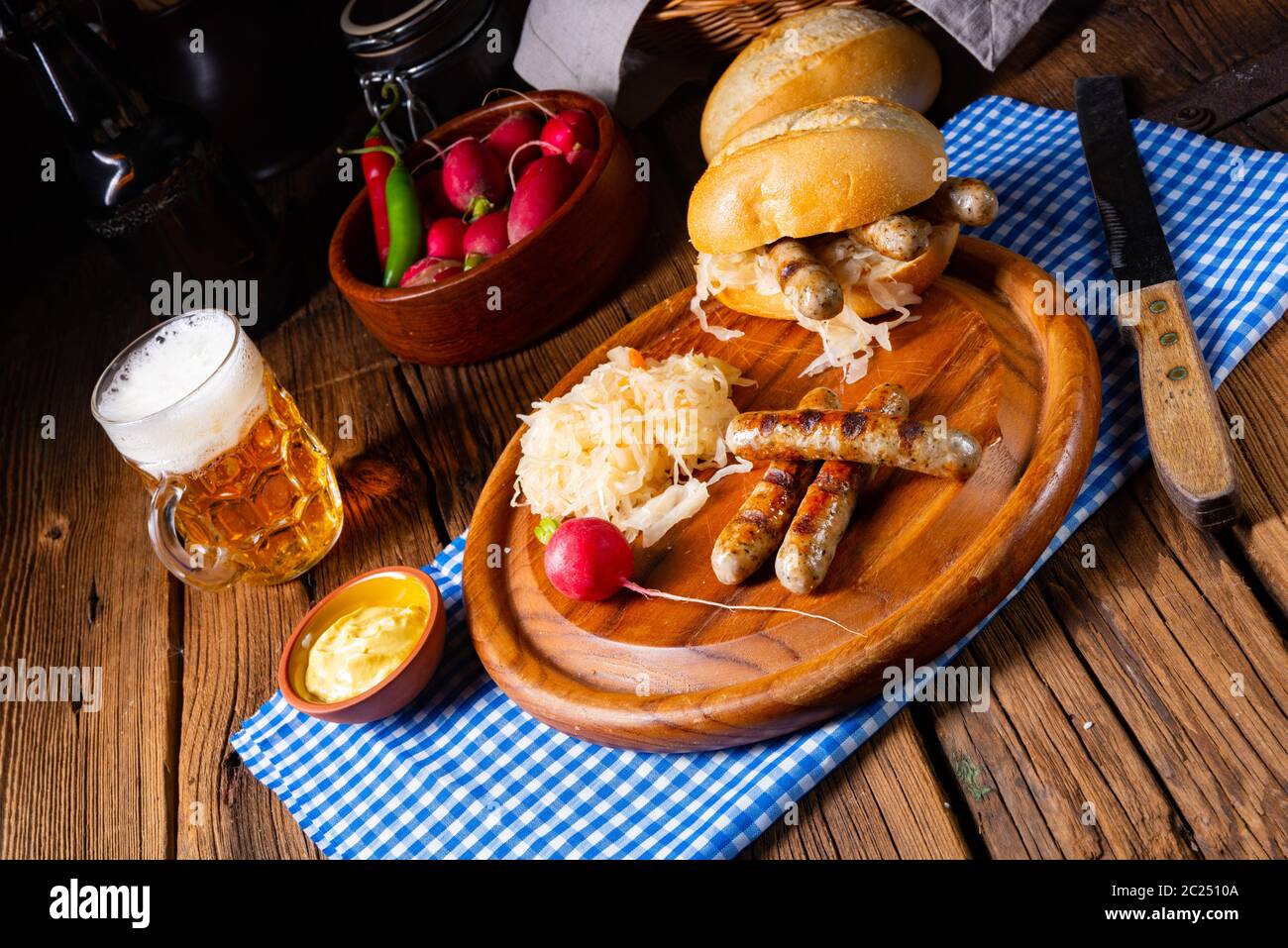 rustic Thuringian bratwurst with sauerkraut and roll Stock Photo - Alamy