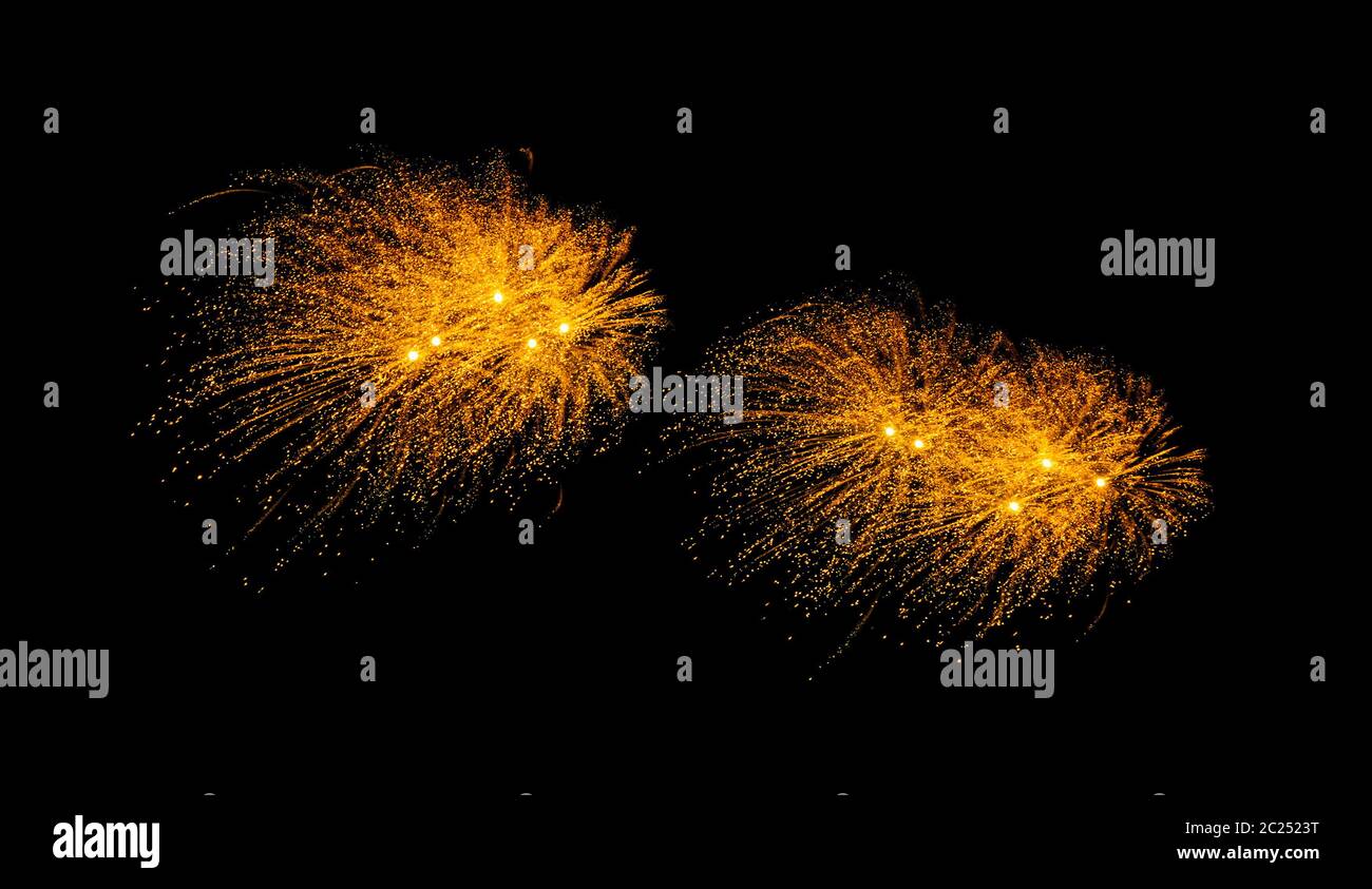Golden exploded fireworks display, isolated on black background Stock ...