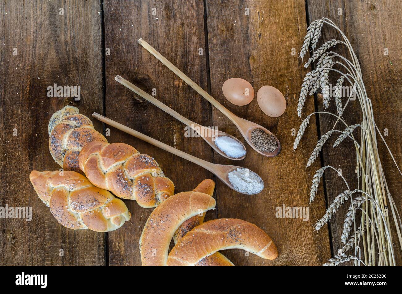 Roll, pastry from home bakery on wood table with wheat Stock Photo - Alamy