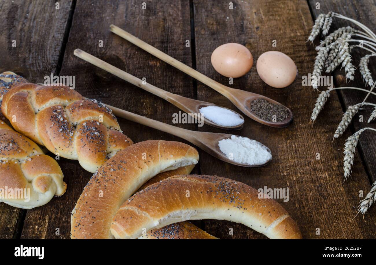 Roll, pastry from home bakery on wood table with wheat Stock Photo - Alamy