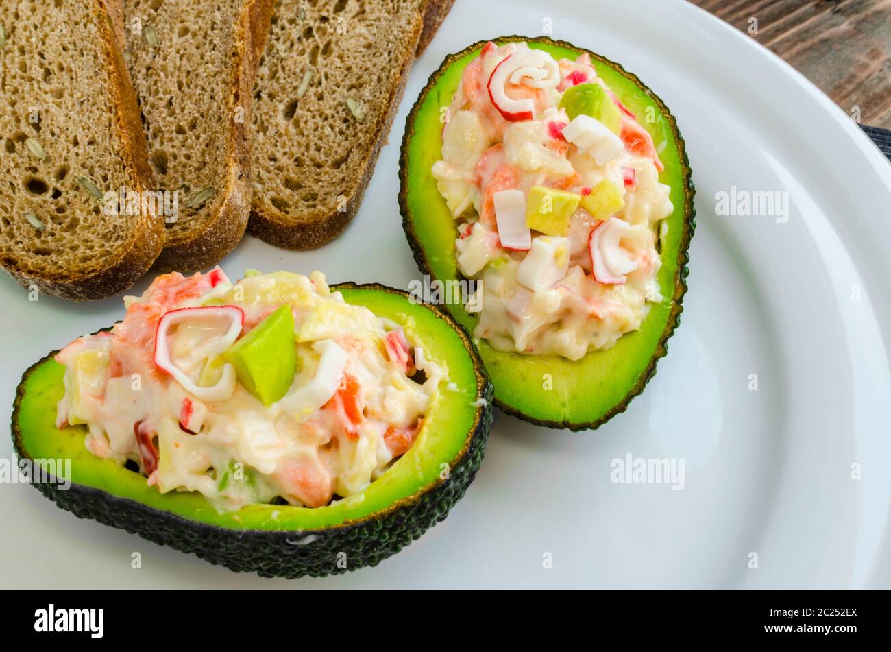 Stuffed with avocado with surimi sticks, paprika mayonnaise with bio ...
