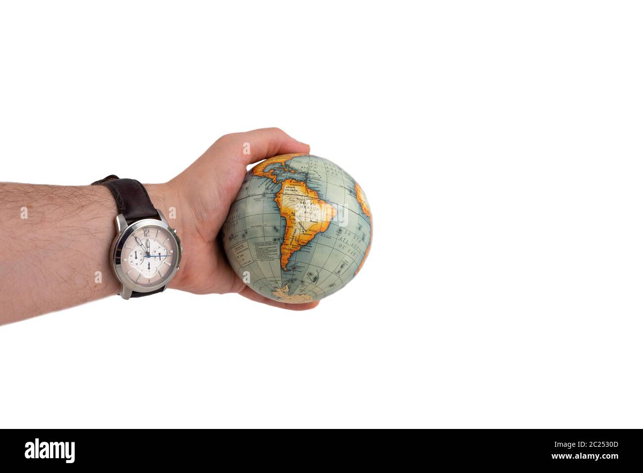 Earth globe in a human hand and the watch shows high time with white ...