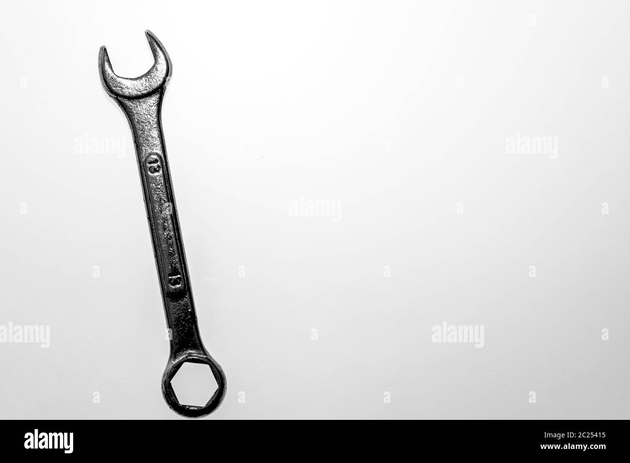 A single wrench on a white background Stock Photo - Alamy
