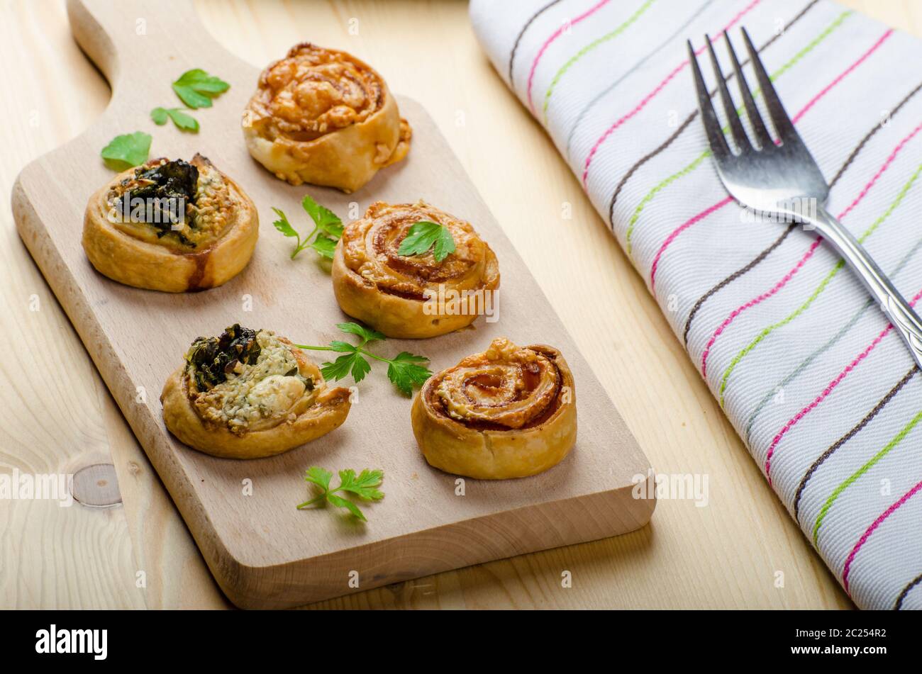 Canapés puff pastry with spinach, garlic blue cheese, easy snack Stock ...