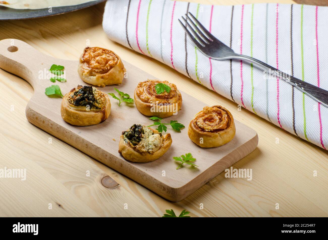Canapés puff pastry with spinach, garlic blue cheese, easy snack Stock ...