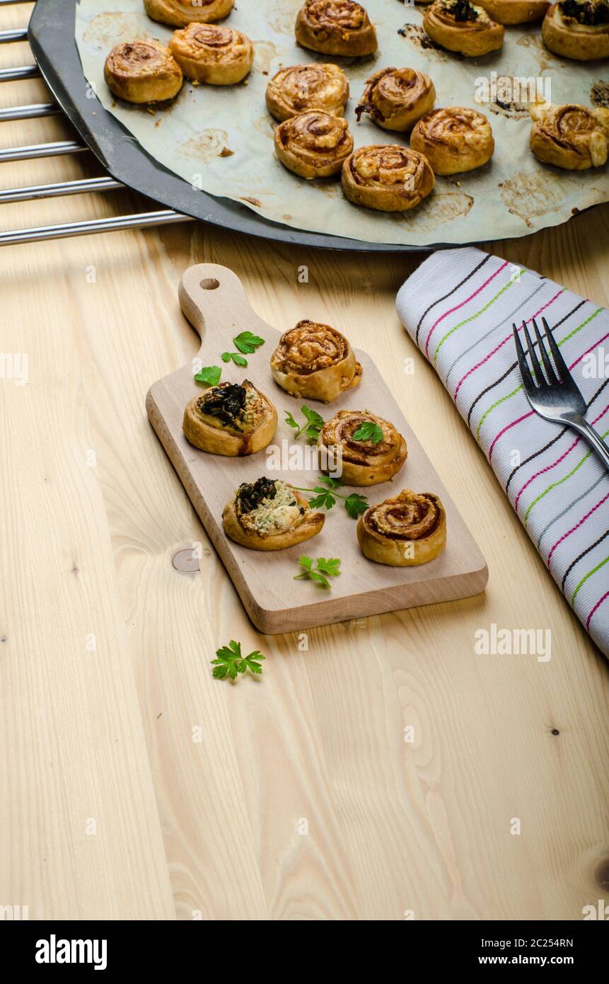 Canapés puff pastry with spinach, garlic blue cheese, easy snack Stock ...