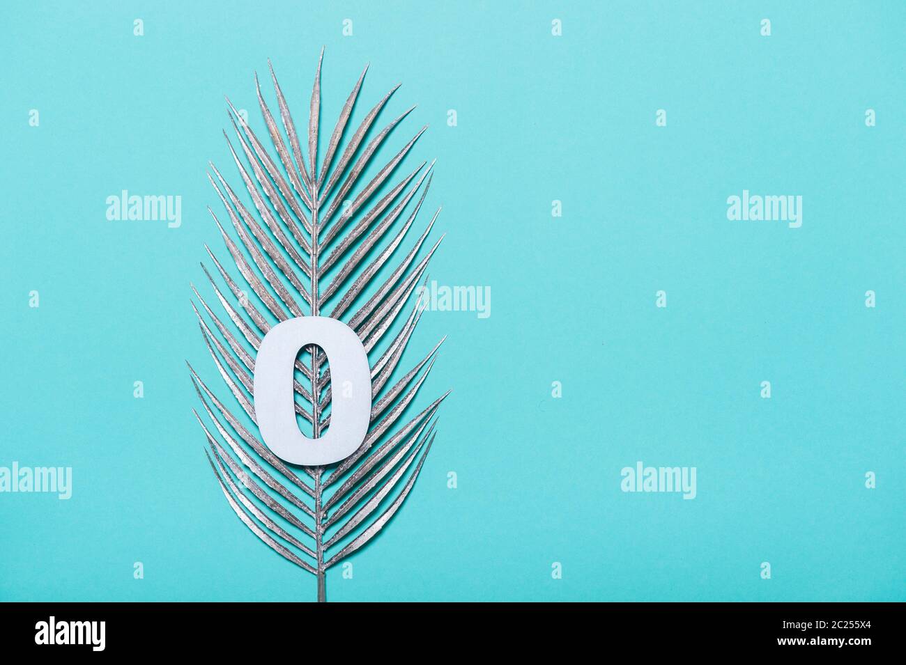 Number zero shape with silver palm leaves on blue background. Summer ...
