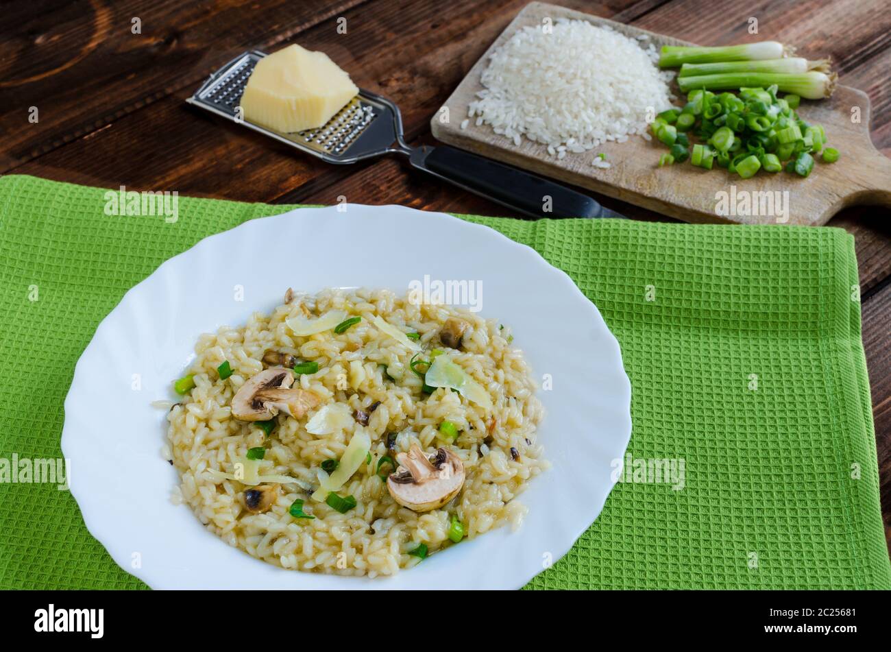 Italien risotto with mushrooms and spring onion Stock Photo - Alamy