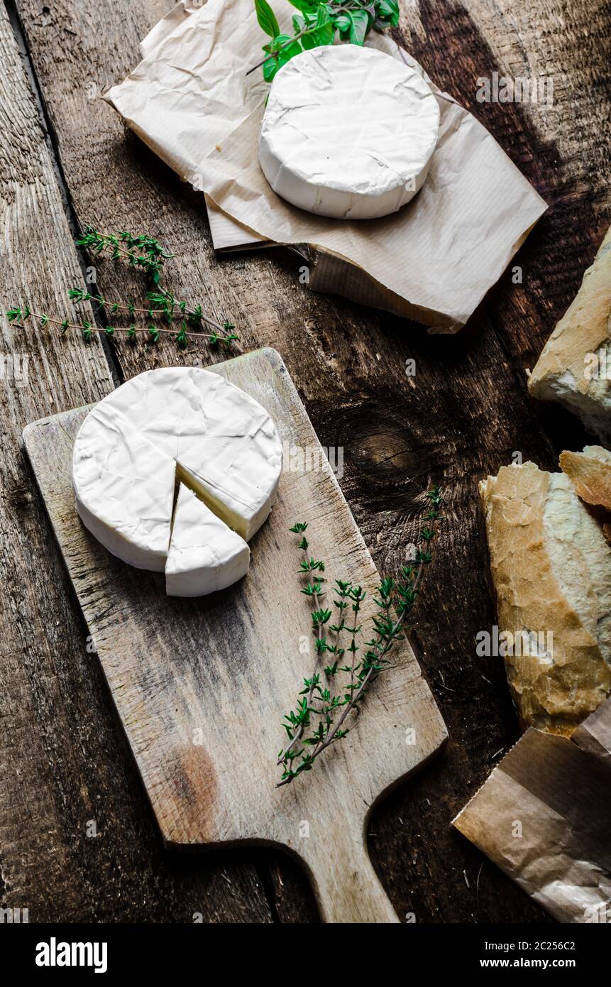 Camembert, soft cheese with homemade pastries, old school Stock Photo ...