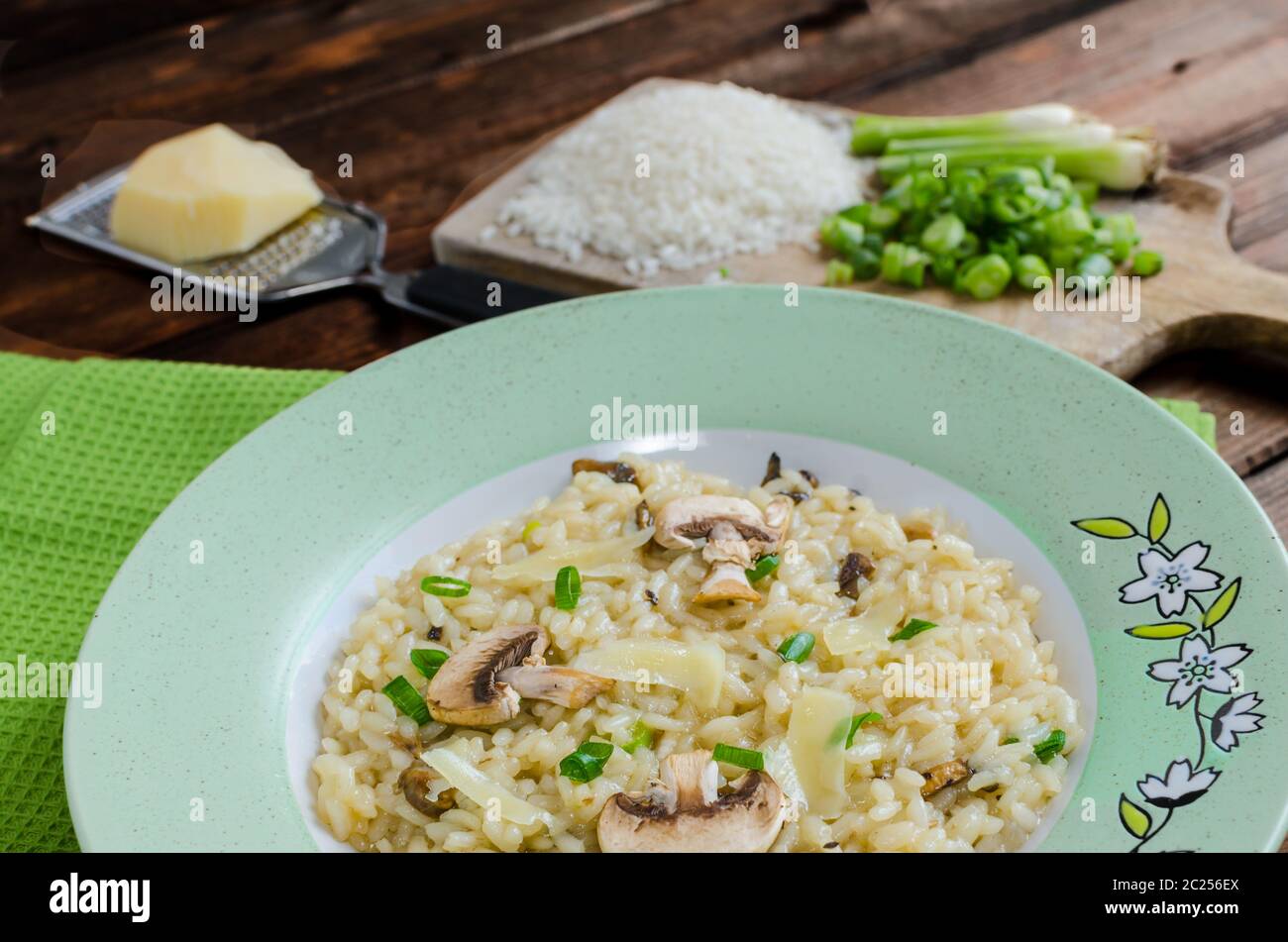Italien risotto with mushrooms and spring onion Stock Photo - Alamy