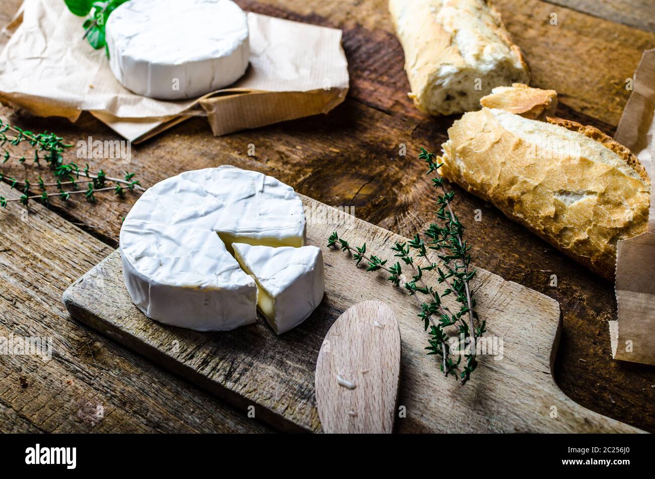 Camembert, soft cheese with homemade pastries, old school Stock Photo ...