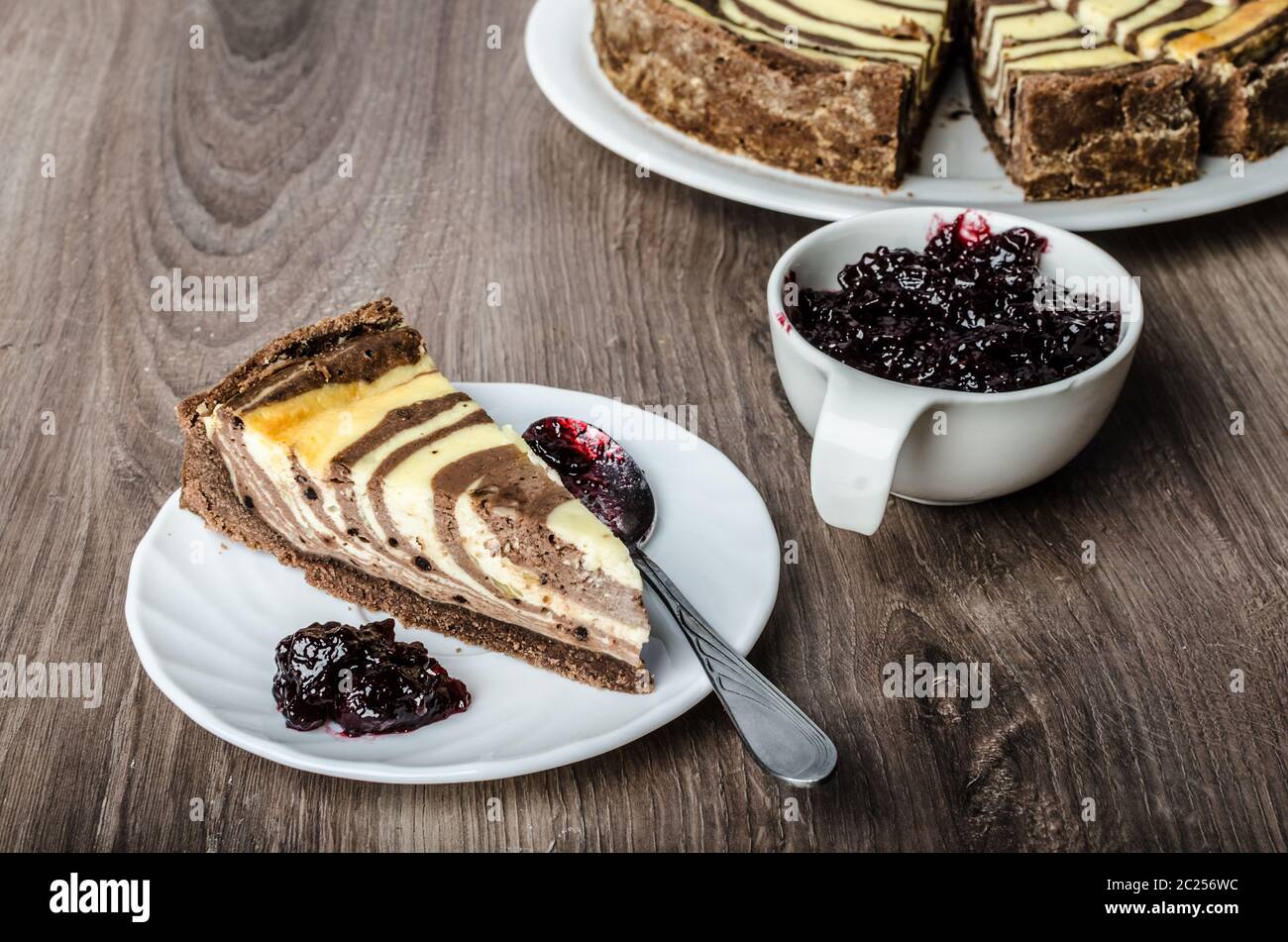 Two-tone cheesecake with homemade cherry jam, homamade Stock Photo - Alamy
