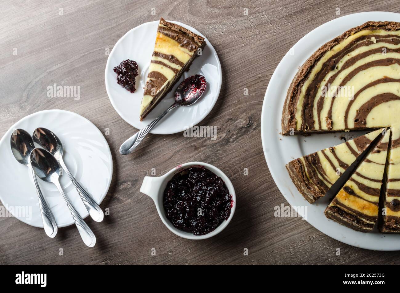 Two-tone cheesecake with homemade cherry jam, homamade Stock Photo - Alamy