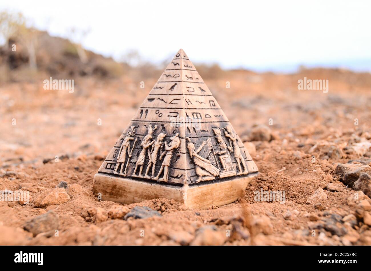 Egyptian Pyramid Model Miniature in the Rock Desert Stock Photo - Alamy