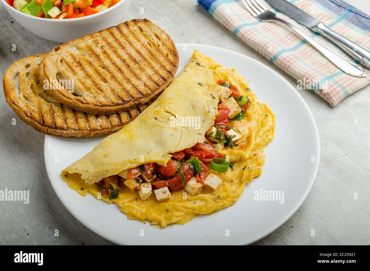 Mediterranean-Style Omlette with crispy garlic bread and apple juice ...