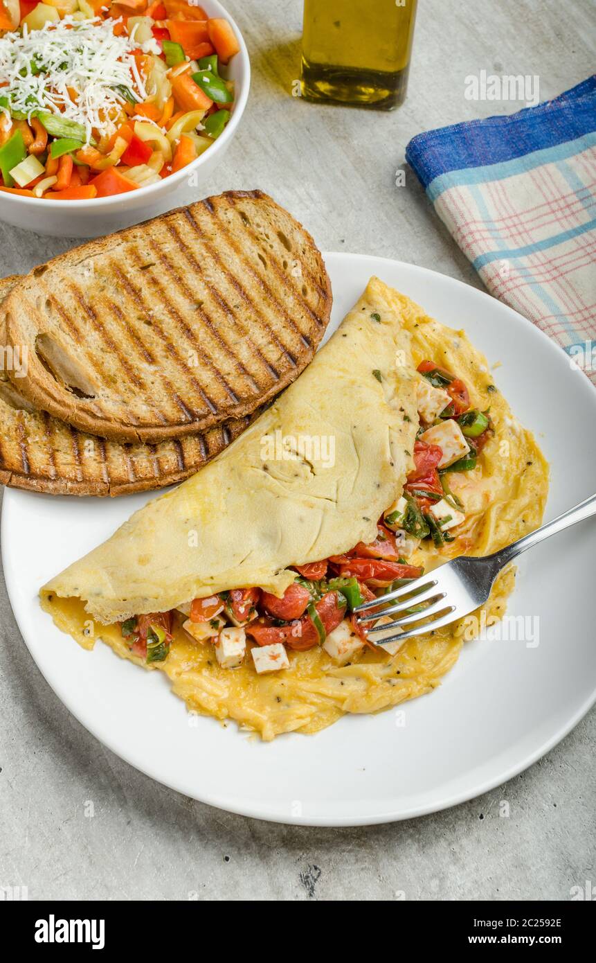 Mediterranean-Style Omlette with crispy garlic bread and apple juice ...