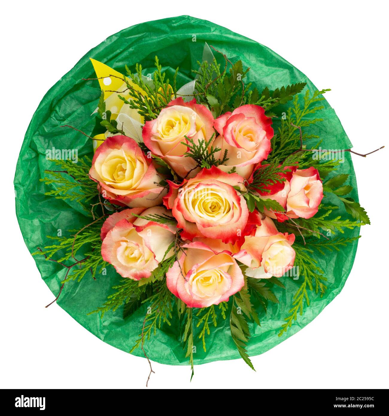 Yellow and red bi-coloured roses arranged with branches and fresh ...
