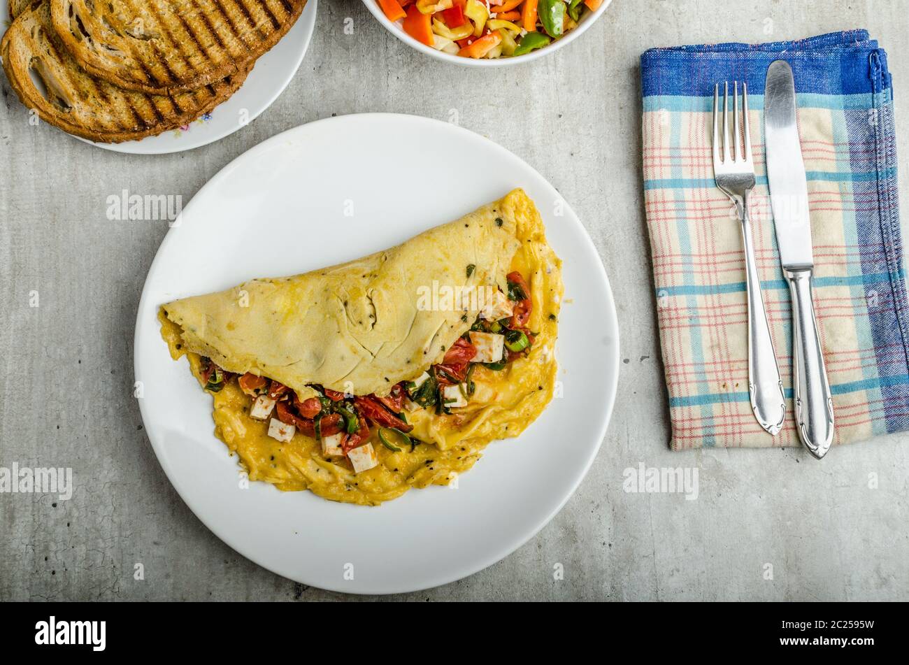 Mediterranean-Style Omlette with crispy garlic bread and apple juice ...