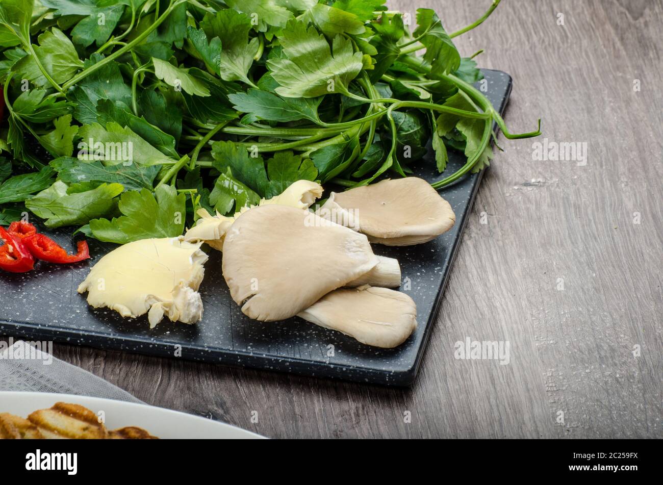 Rustic vegetarian omelette with chili peppers and mushrooms Stock Photo ...