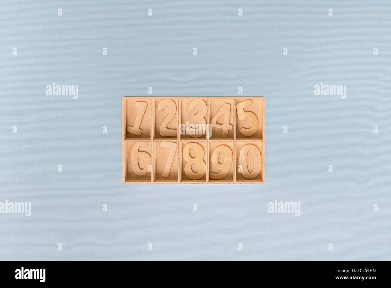 numbers arranged in an orderly fashion in a wooden box Stock Photo - Alamy