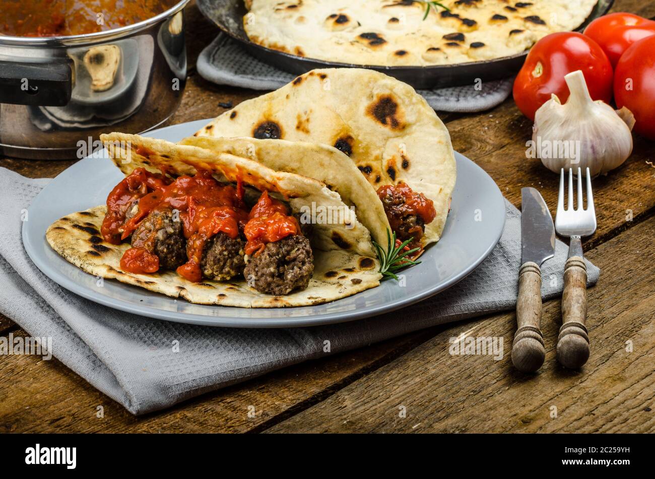 Indian naan with meatballs and tomato sauce, spicy sauce and exotic ...