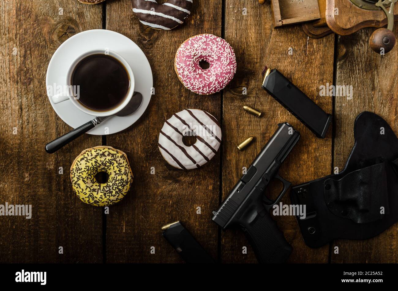 American police officer morning, donuts, juice, fresh black coffee and ...