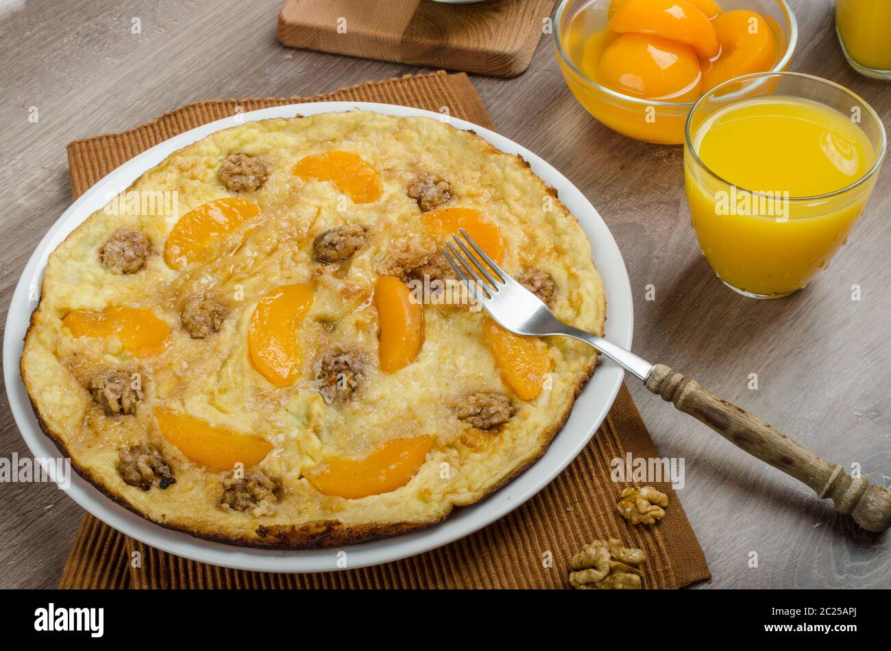 Sweet Egg omelet with walnuts, peaches - sprinkled with cinnamon and ...