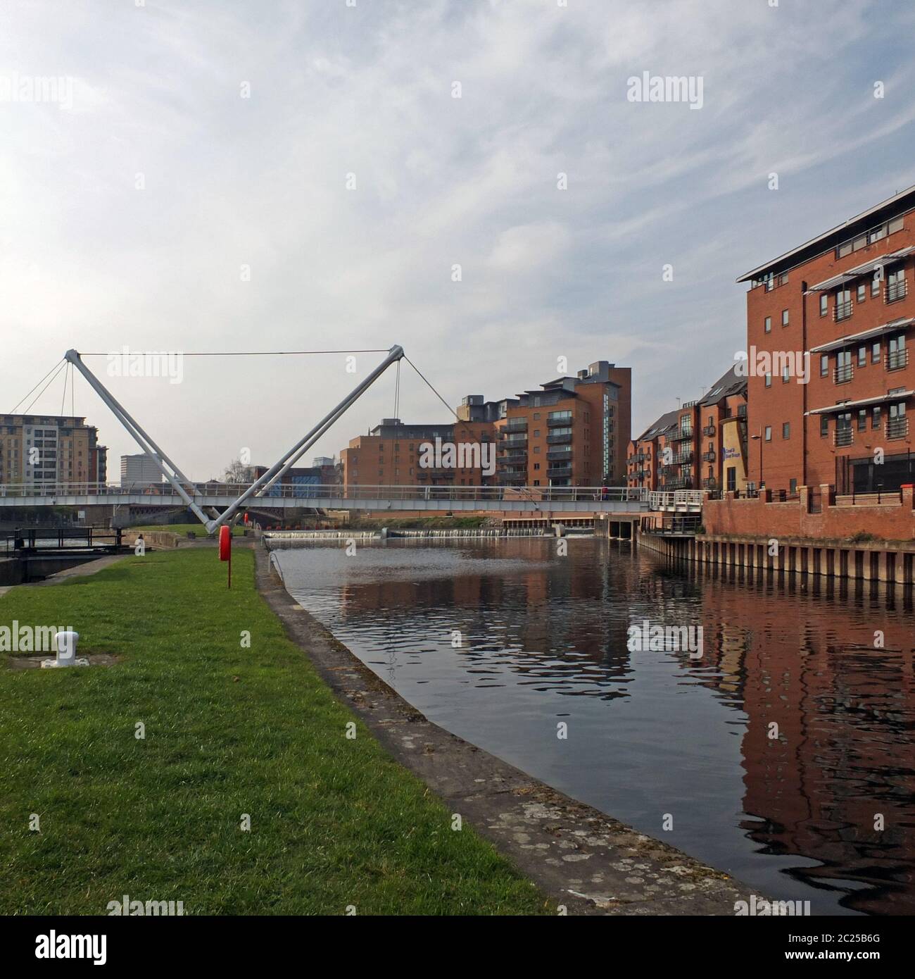 the leeds lock entrance to clarence dock with footbridge over the river ...