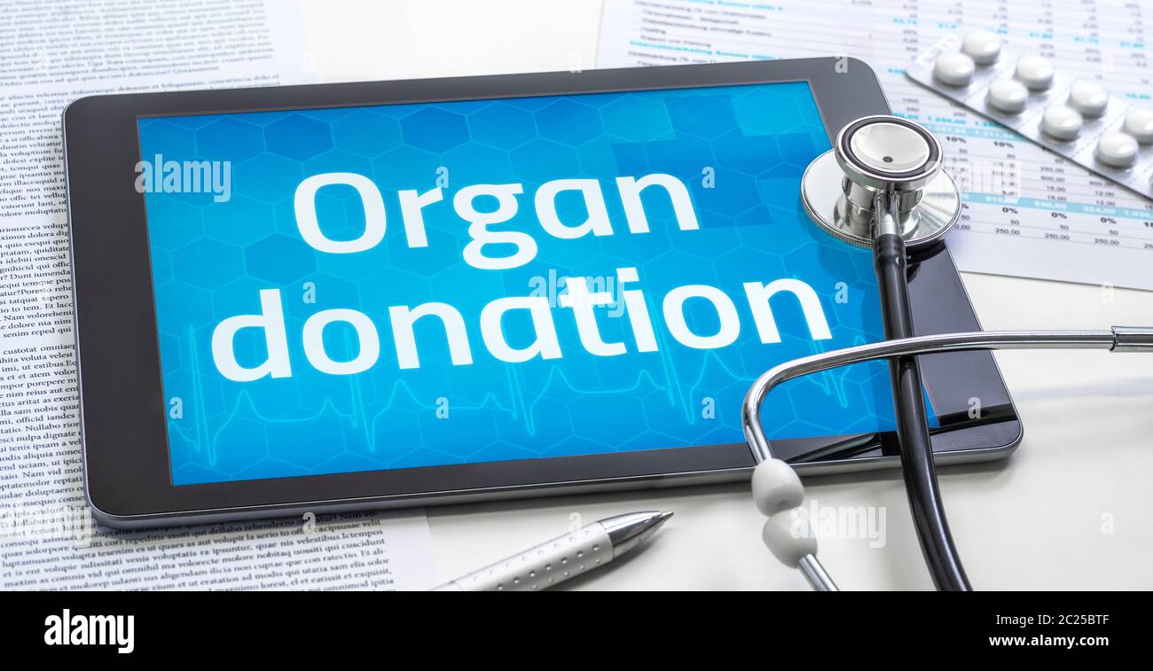 The word Organ donation on the display of a tablet Stock Photo - Alamy