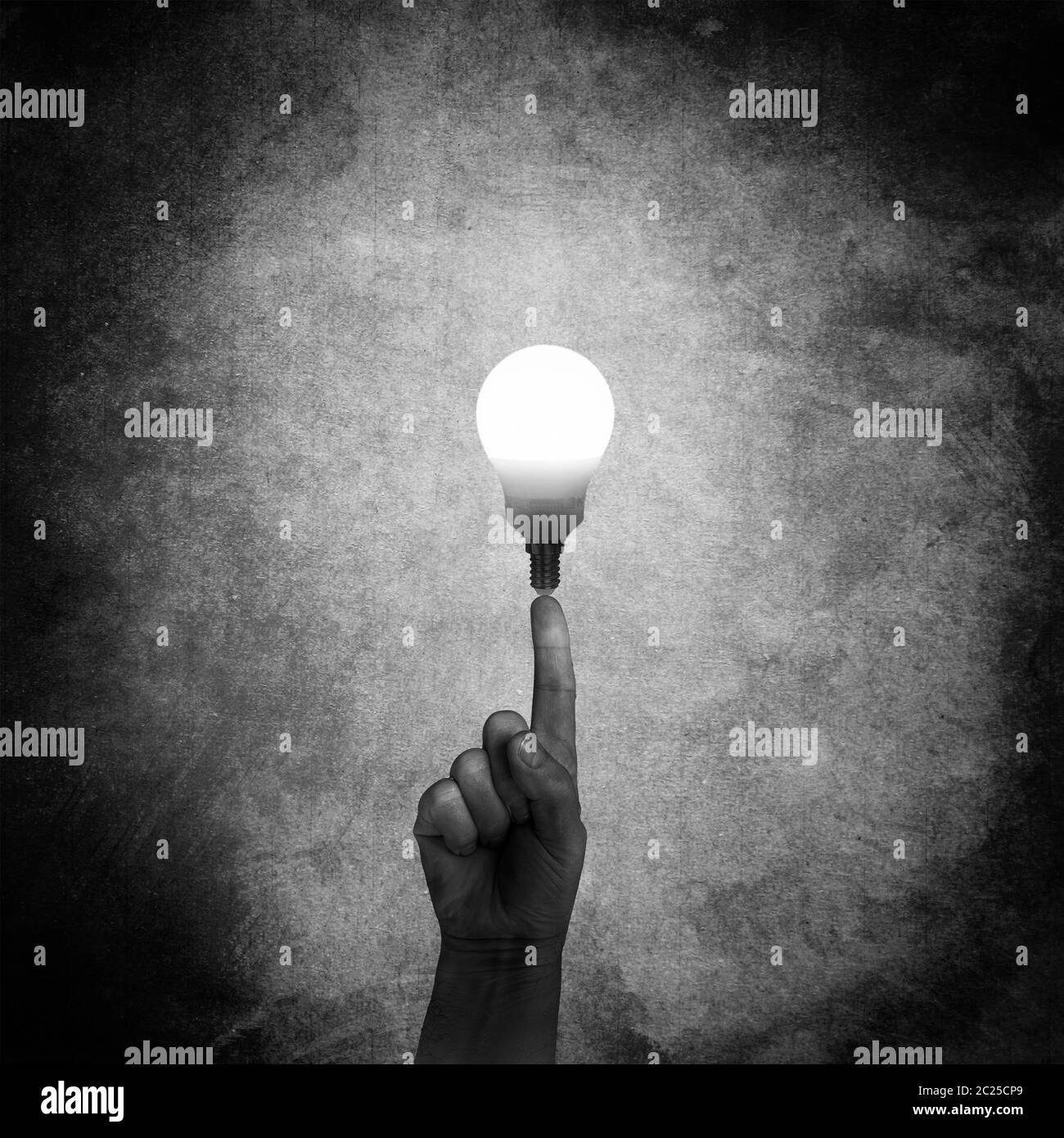 a light bulb lit on the tip of a finger Stock Photo - Alamy